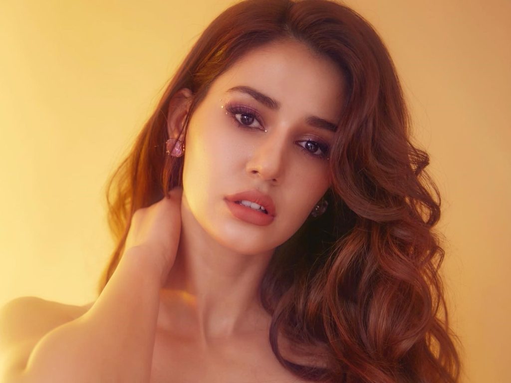 Disha Patni poses on the bench wearing a transparent dress without bra ...